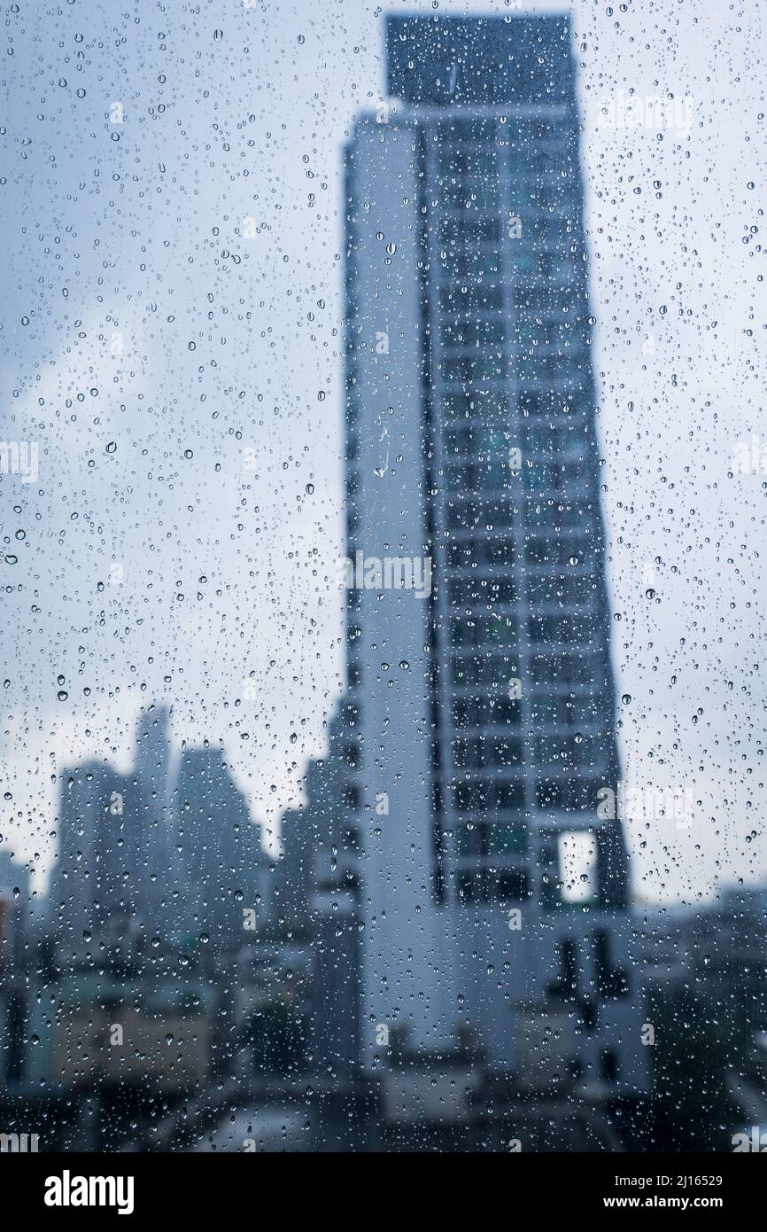 Abstract image of Rain drops on the dirty glass windows with modern ...