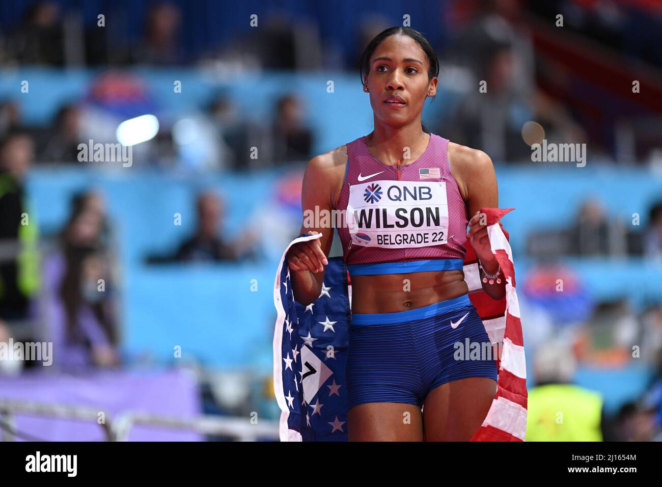 Ajee Wilson celebrating her victory with her flag at the Belgrade 2022 ...