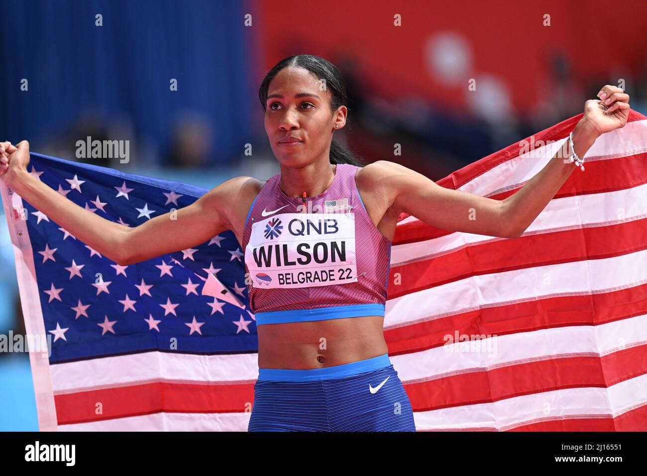 Ajee Wilson celebrating her victory with her flag at the Belgrade 2022 ...