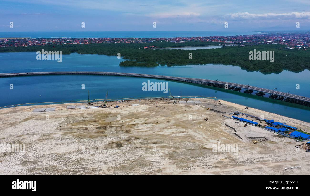 Aerial view of Bali Mandara toll road over sea. Car, motorbike bridge ...