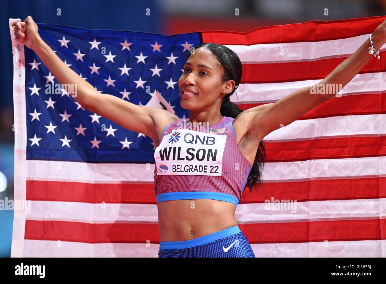 Ajee Wilson celebrating her victory with her flag at the Belgrade 2022 ...