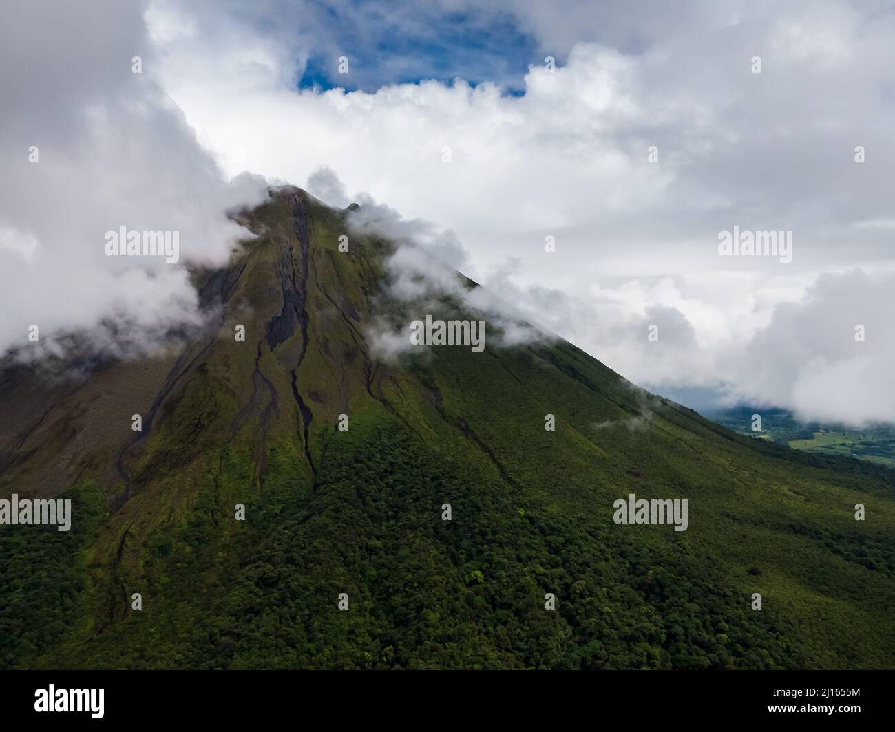 Beautiful cinematic aerial view of the Arenal Volcano in Costa Rica ...