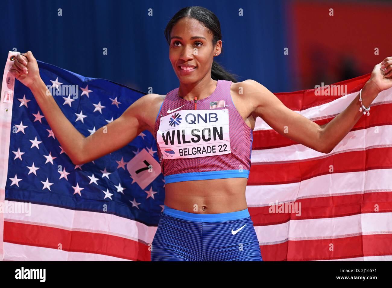Ajee Wilson celebrating her victory with her flag at the Belgrade 2022 ...