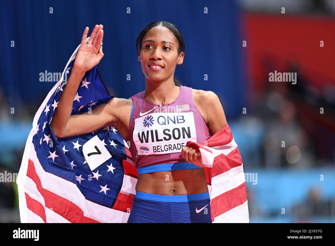 Ajee Wilson celebrating her victory with her flag at the Belgrade 2022 ...