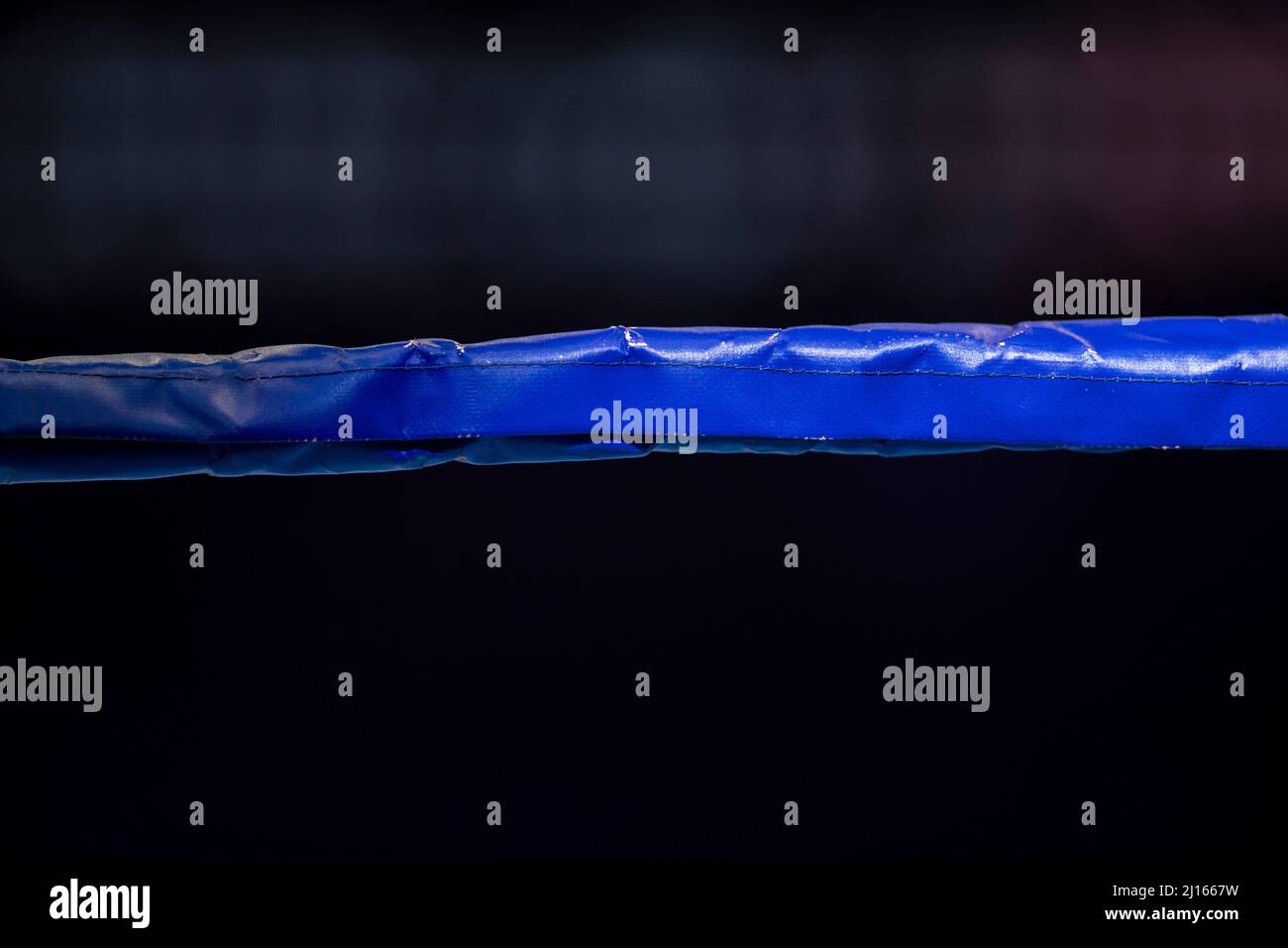 Boxing, muay thai and kickboxing ring ropes with a blur spotlight ...