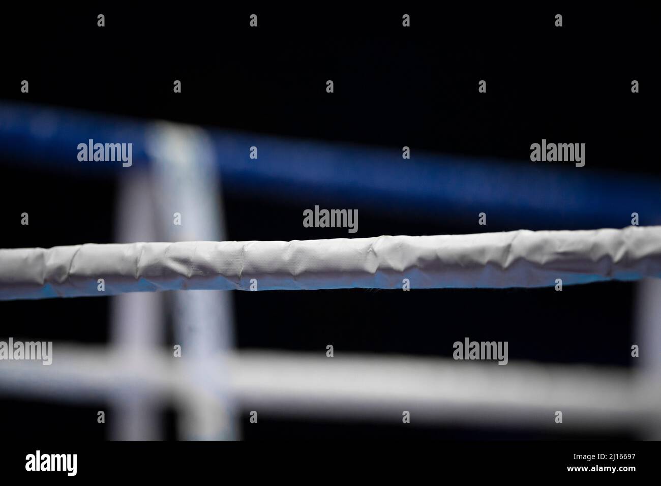 Boxing ring ropes with a blur spotlight. Horizontal sport theme poster ...