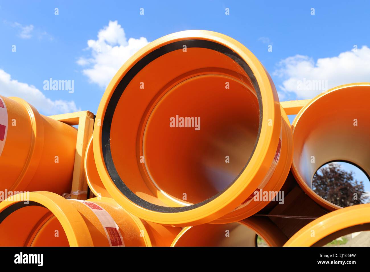 Pile of tubes (kg sewer pipes) on a building site Stock Photo - Alamy