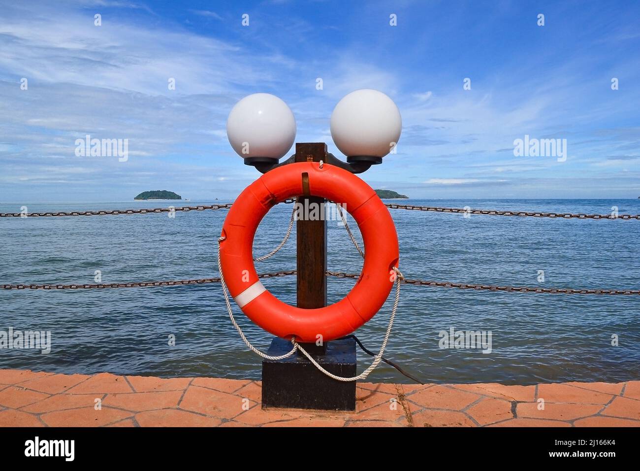 Lifeguard ring buoys with blue cloud sky view at the beach Stock Photo ...
