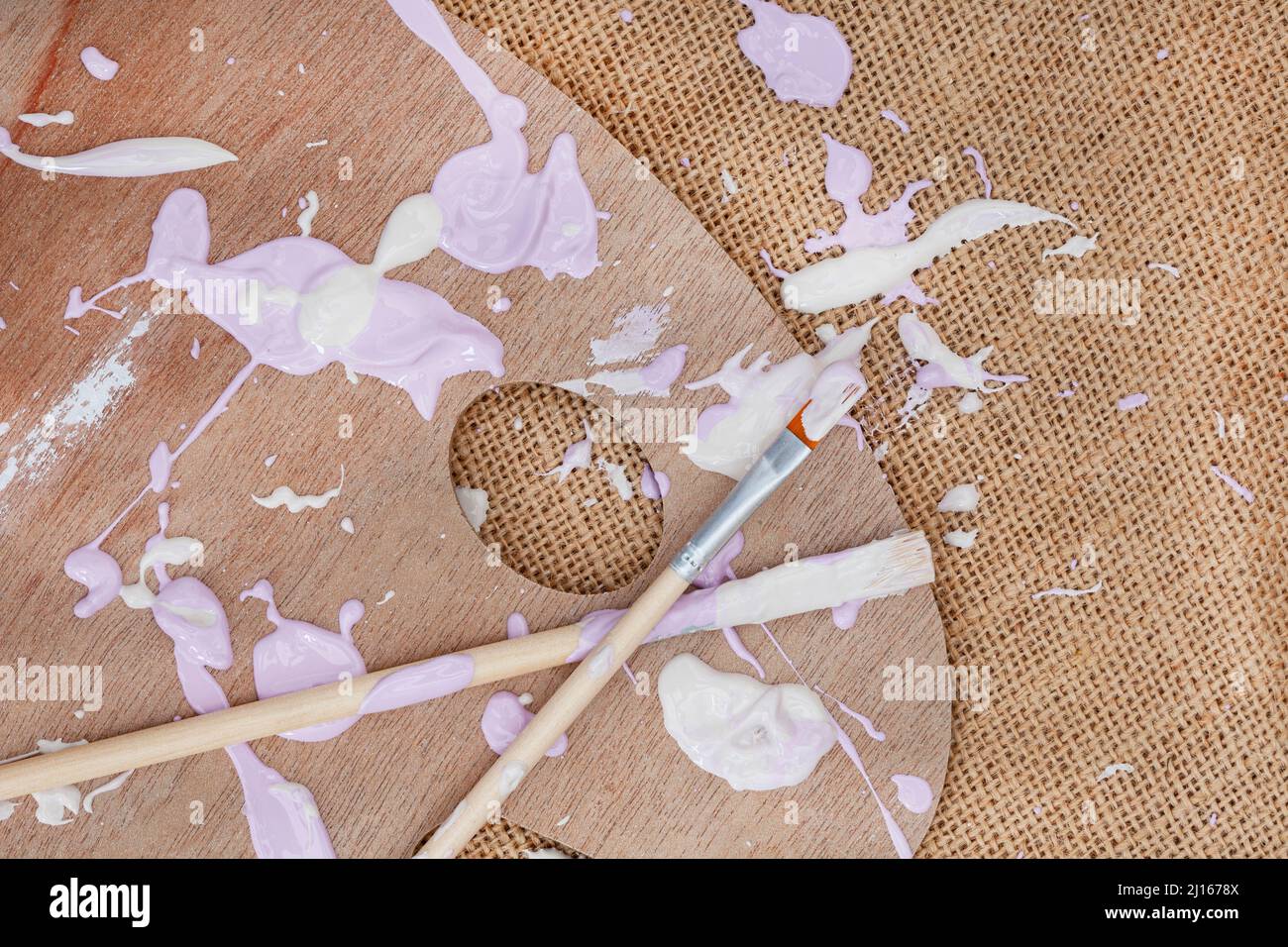 rustic hessian surface with neutral colored paint pallet, pastel ...