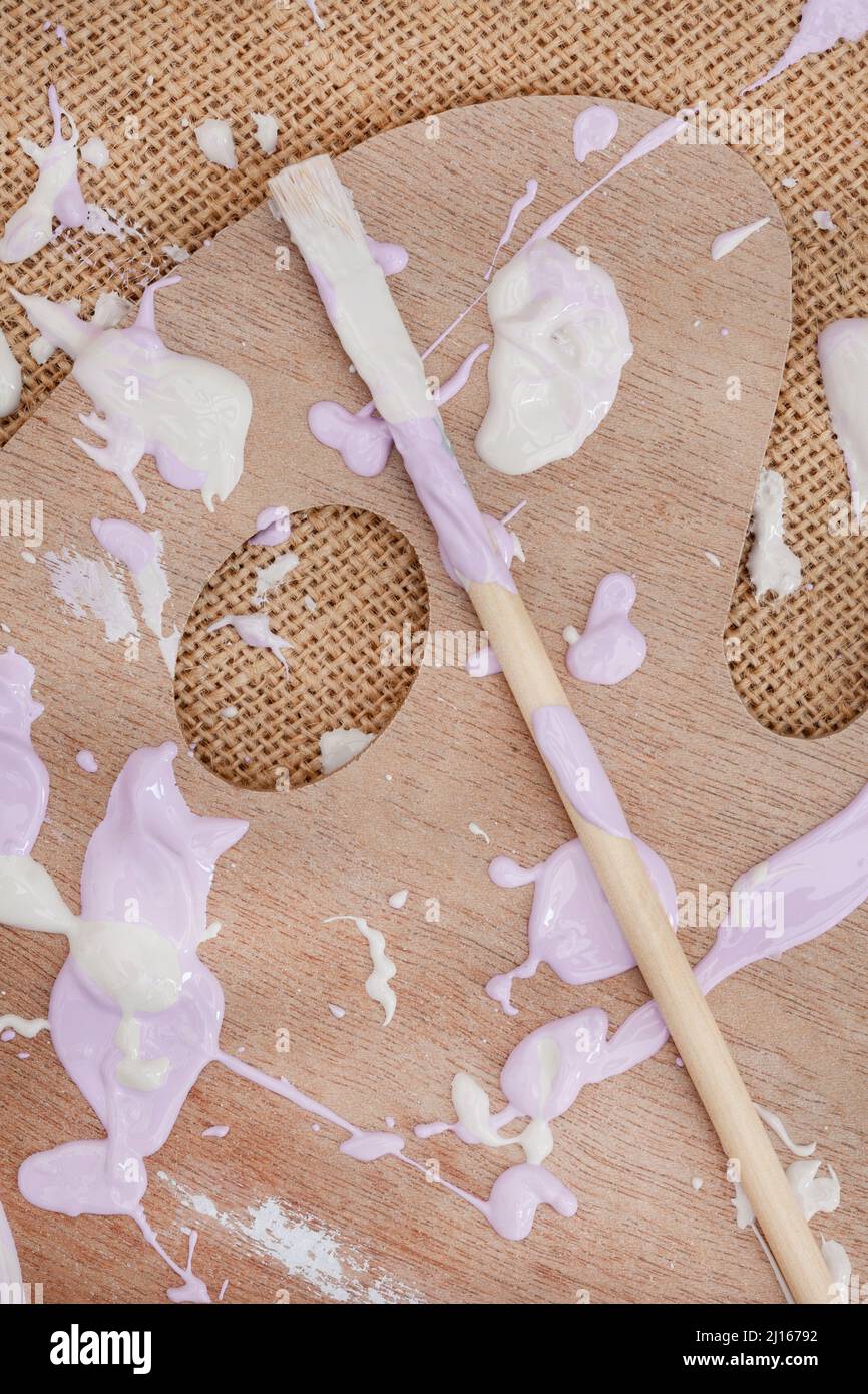 rustic hessian surface with neutral colored paint pallet, pastel ...