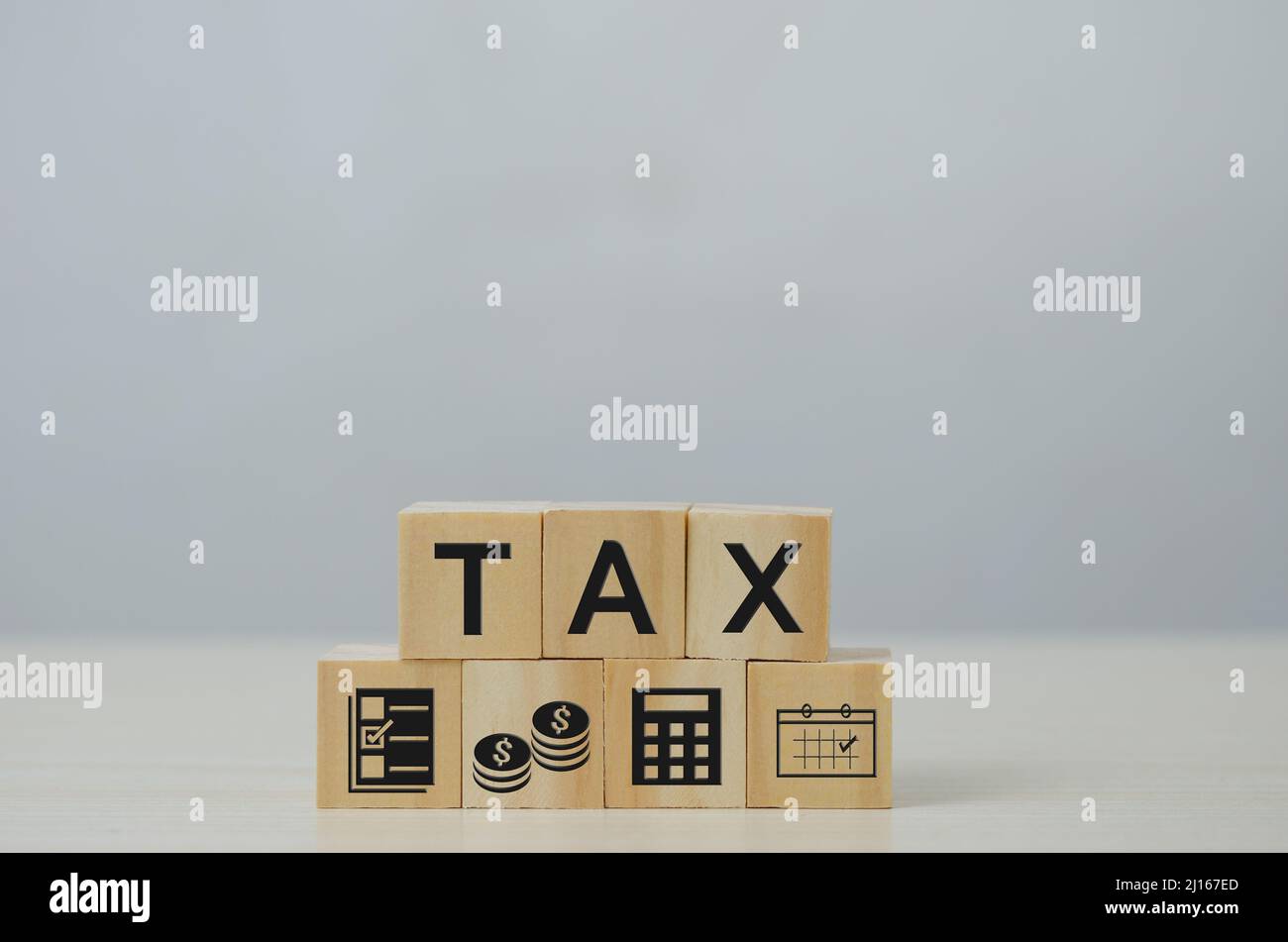 wooden cube block icon TAX business Concept Stock Photo - Alamy