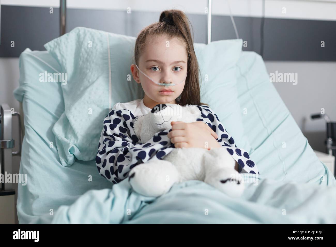 Unwell child in healthcare pediatric clinic patients recovery ward room ...