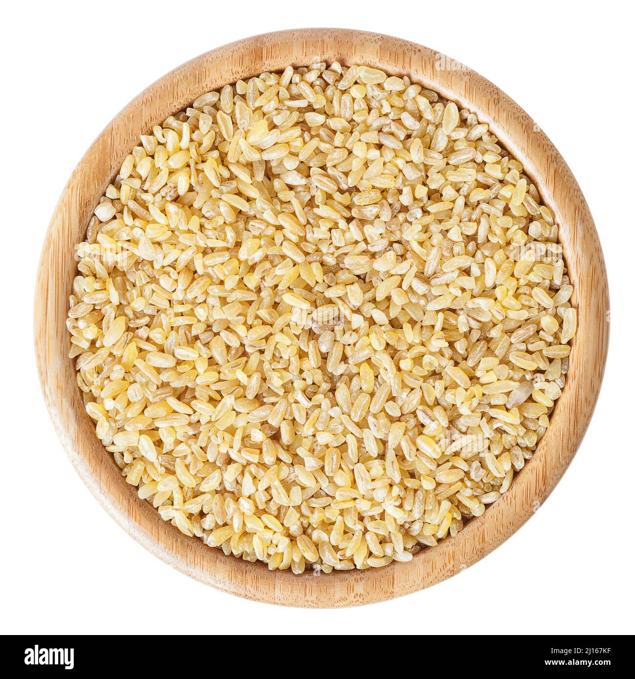 Uncooked bulgur in wooden bowl isolated on white background with ...