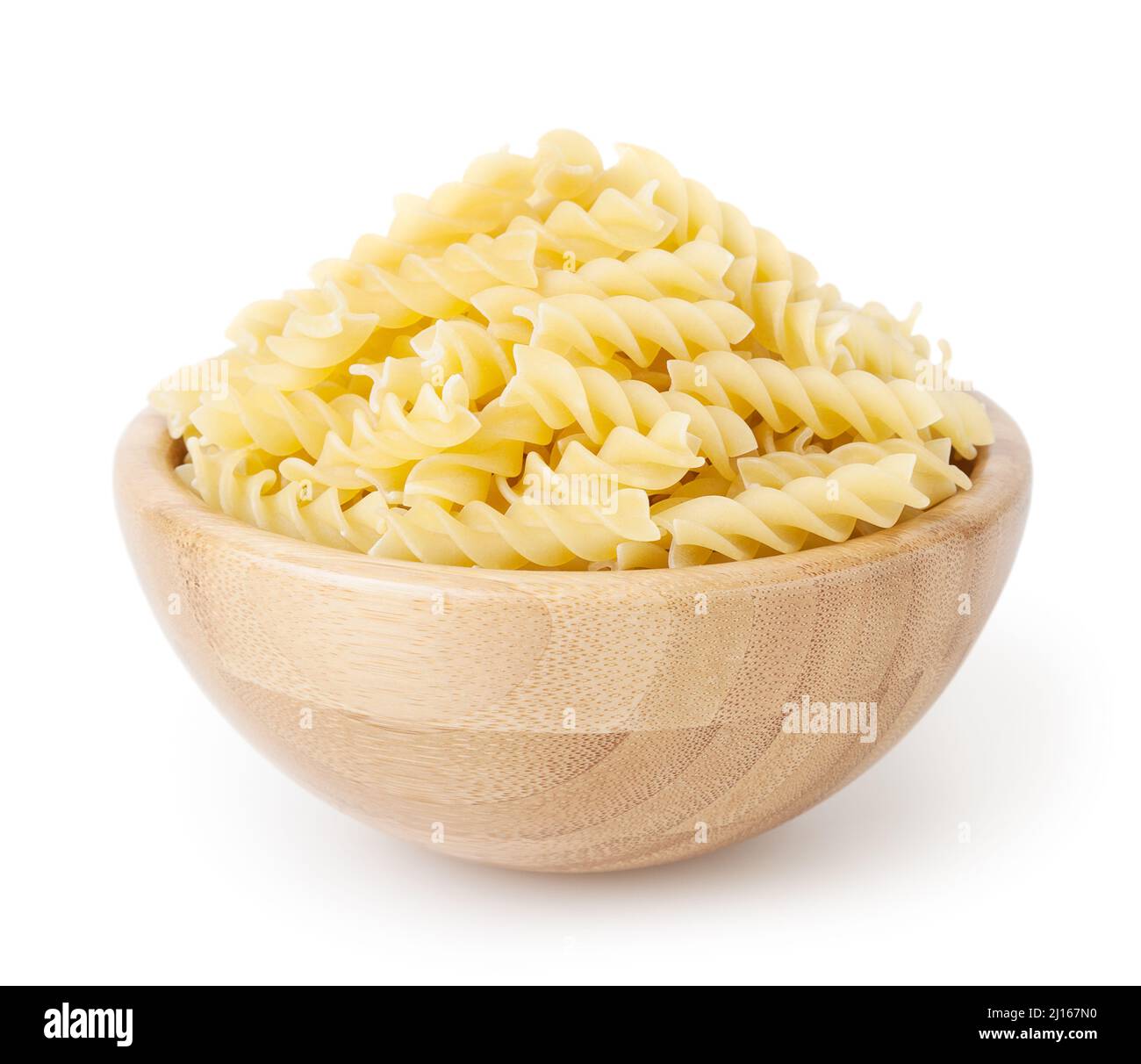 Uncooked fusilli pasta in wooden bowl isolated on white background with ...