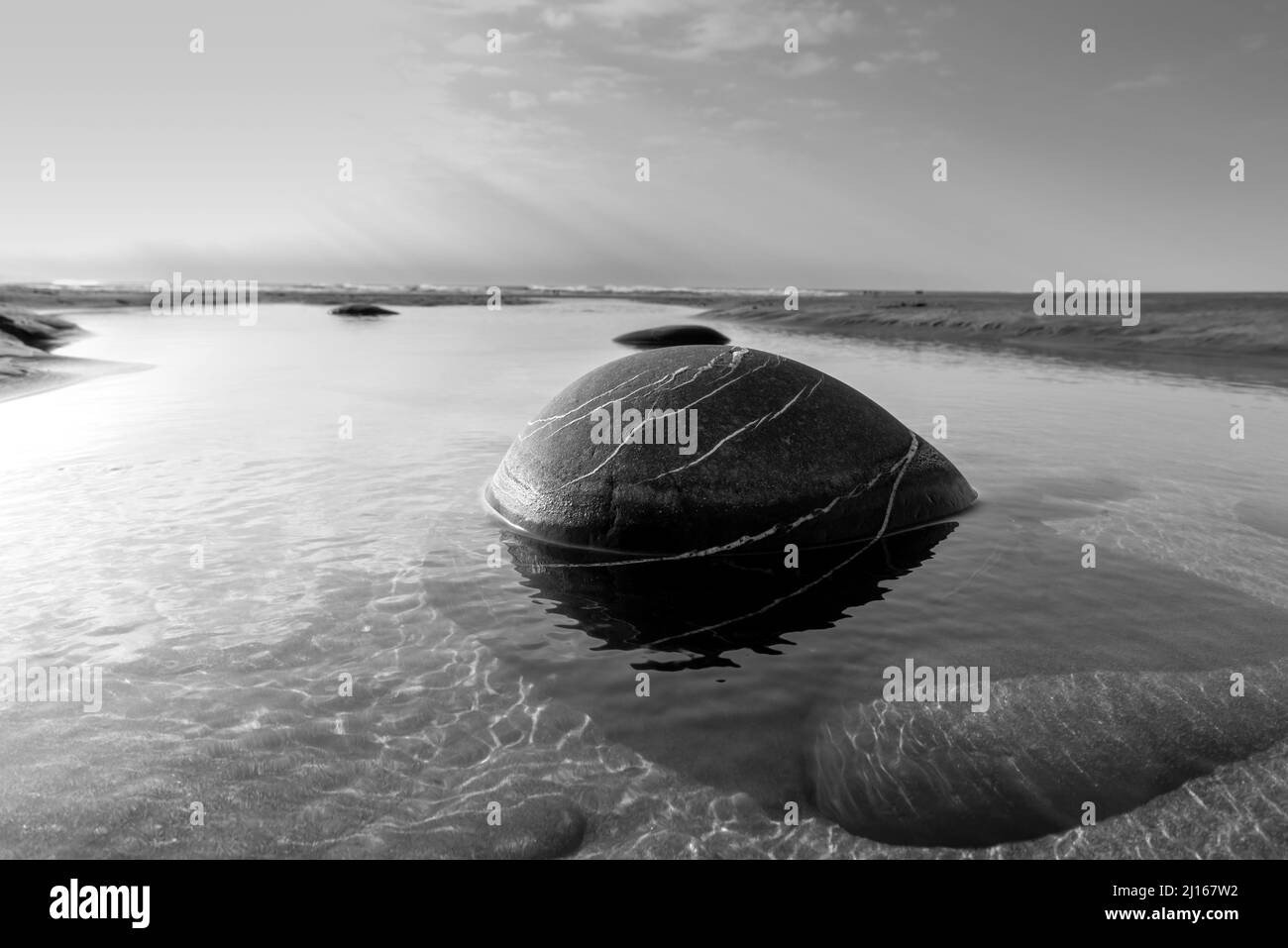Clear water in a rock pool with patterned stone and reflections Stock ...