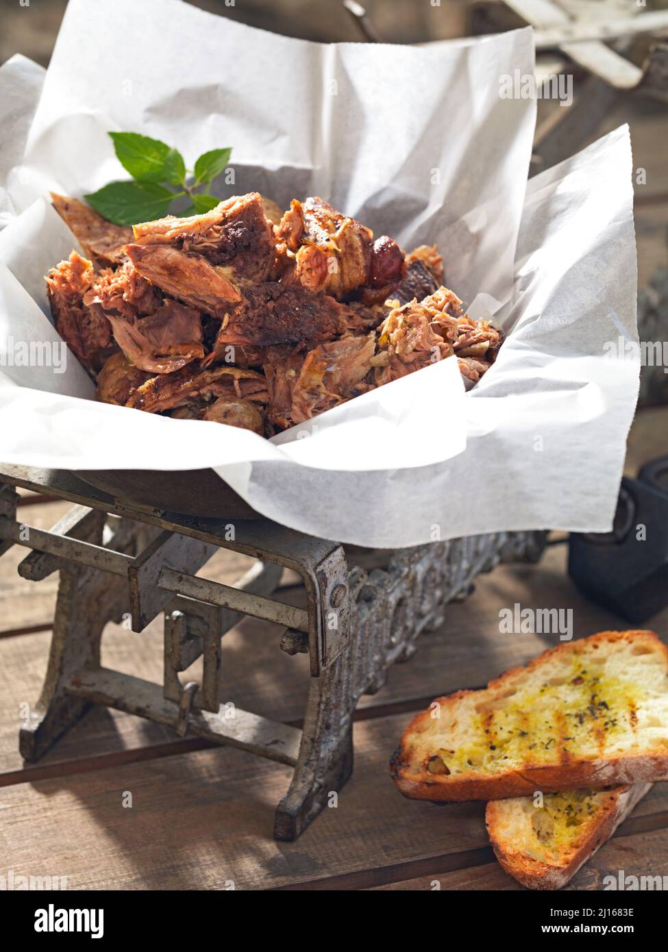 lamb slowly cooked in a traditional Greek way in a baking sheet with ...