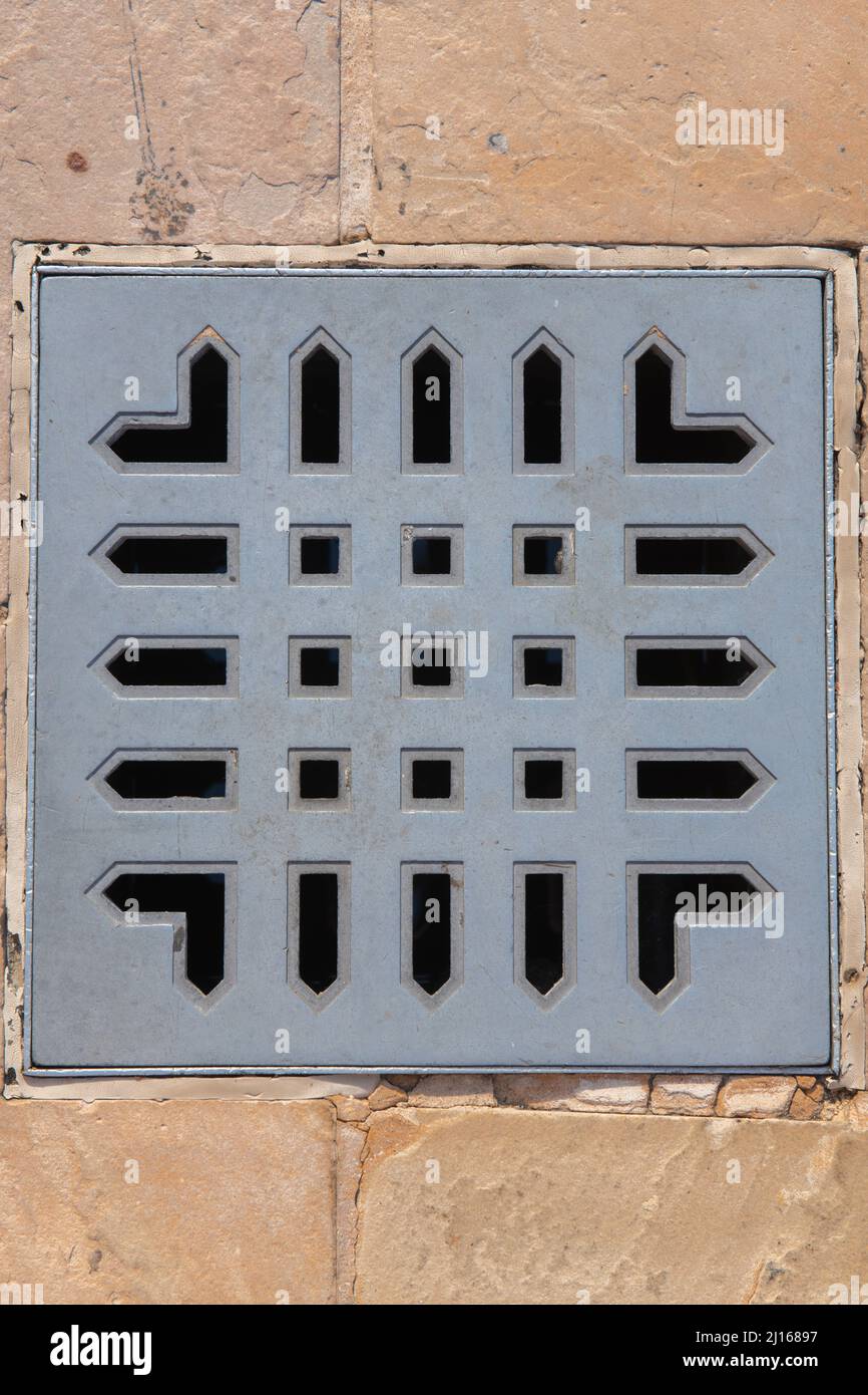 gray square metal manhole on the sidewalk Stock Photo - Alamy