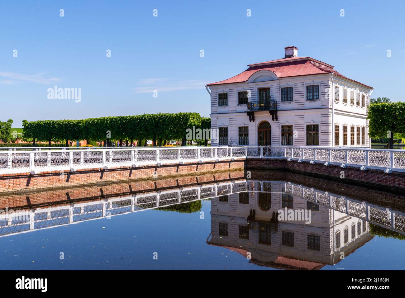 Marly palace and reflection in pond in the western path of Lower Park ...