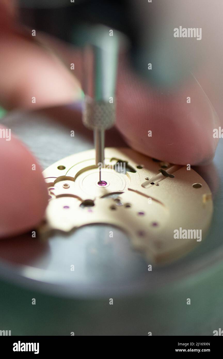 25 February 2022, Saxony, Glashütte: Sarah Westermann uses a dial gauge ...