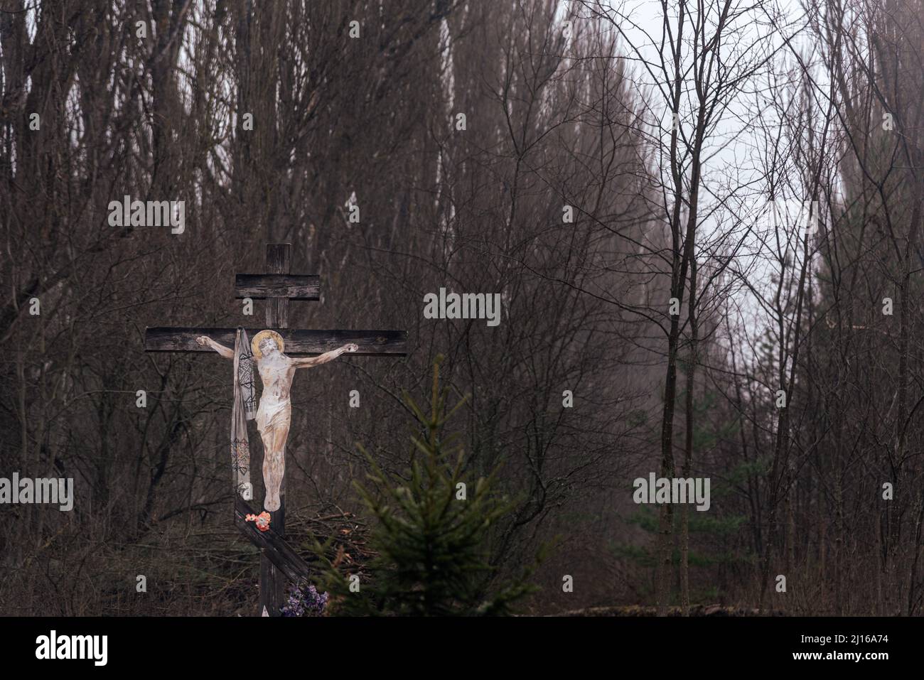 A statue of Jesus Christ at entrance of the ghost city of Pripyat, in ...