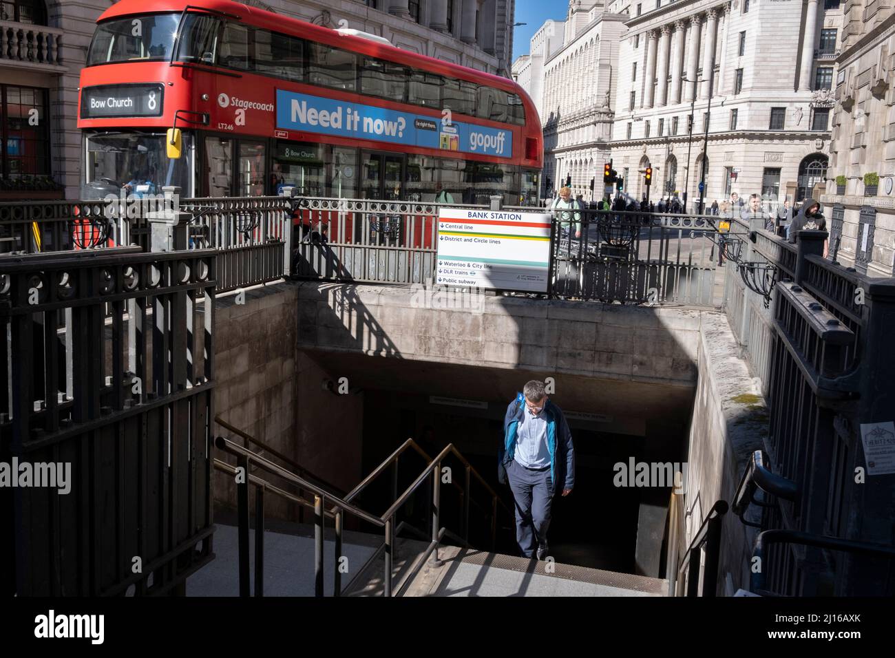 As a bus drives past, a commuter exits Bank Underground Station at the ...