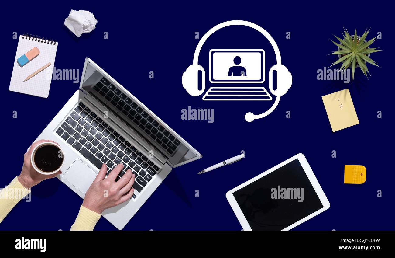 Top view of hands using laptop with symbol of video conference concept ...