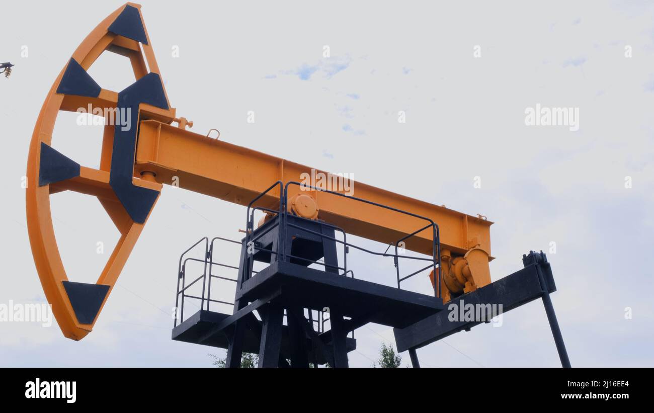 industrial landscape. oil field. Oil pumps against the blue sky. The ...