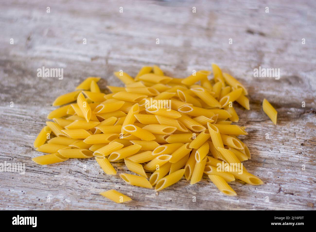 Italian penne ready to be cooked Stock Photo - Alamy