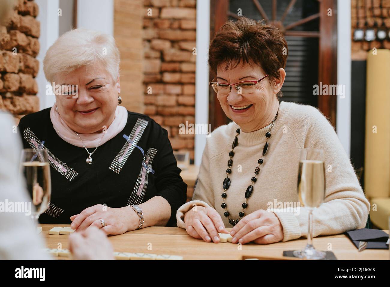 Table two women sit hi-res stock photography and images - Alamy