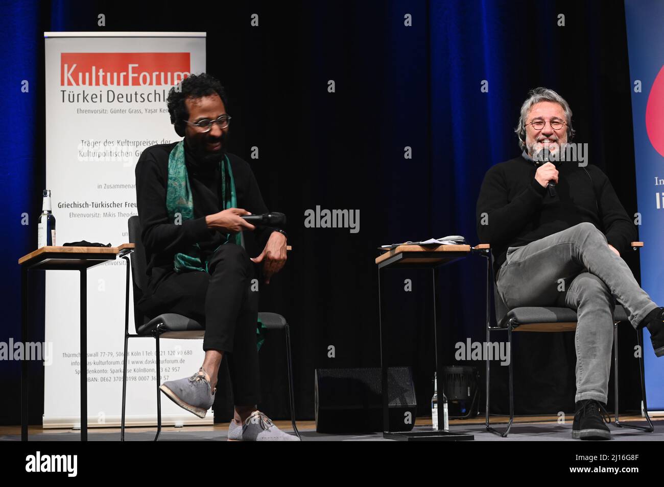 Cologne, Germany. 22nd Mar, 2022. Turkish journalist Can Dündar (r) and ...