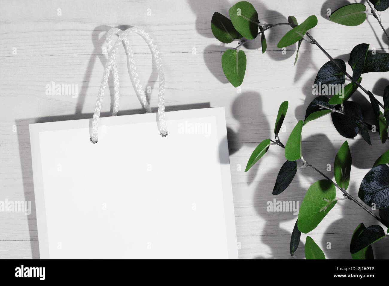 Product advertising background. White paper pocket bag on a wooden ...