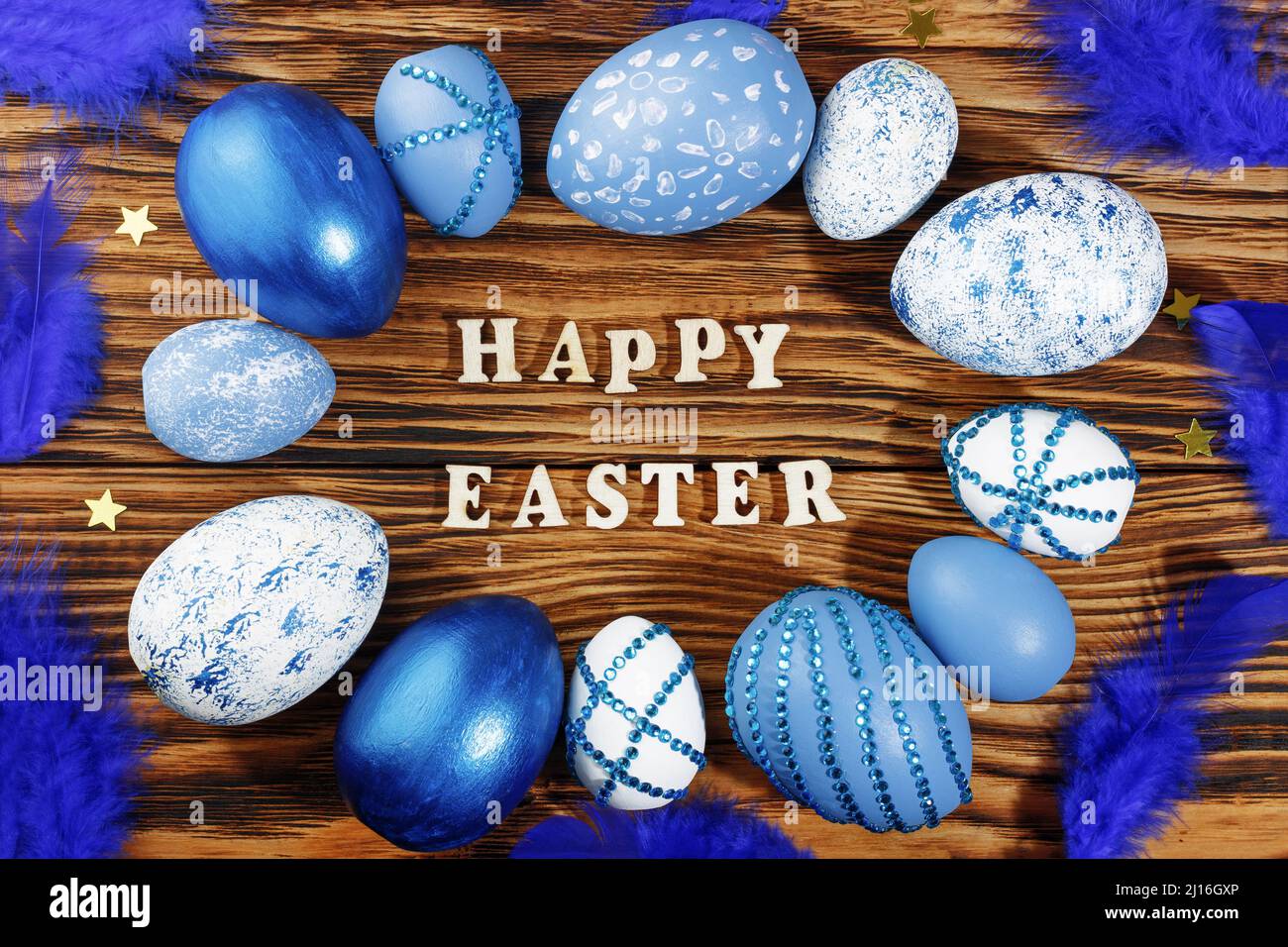 Happy easter, lettering on stylish wooden table, background. Blue and ...