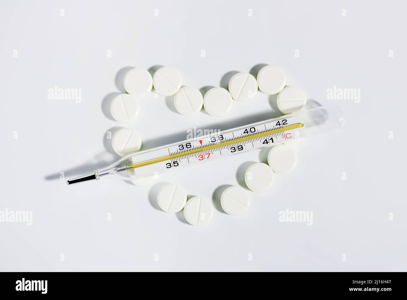 Medical device thermometer, with pills in the shape of a heart ...