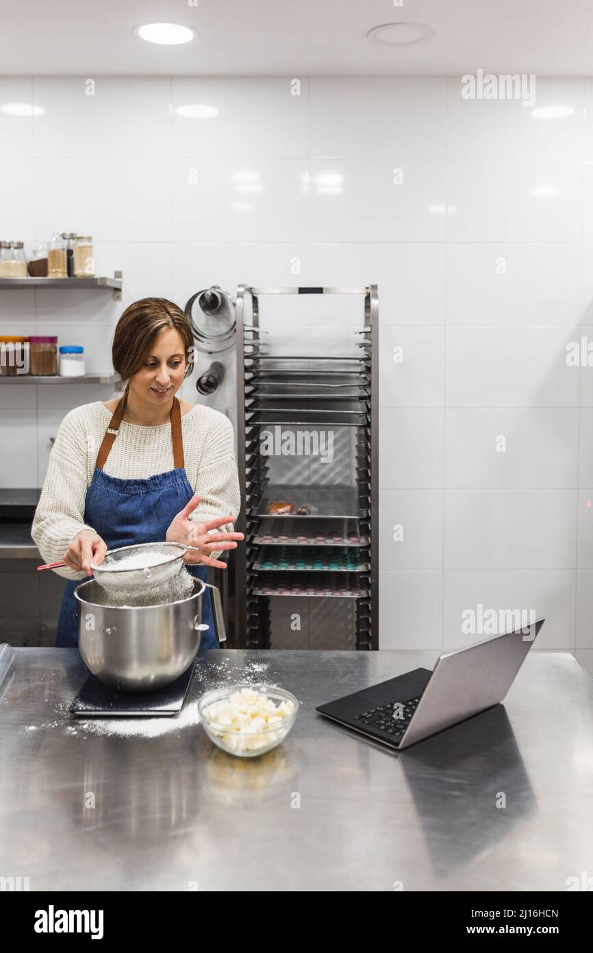 Chef at work with a laptop hi-res stock photography and images - Alamy