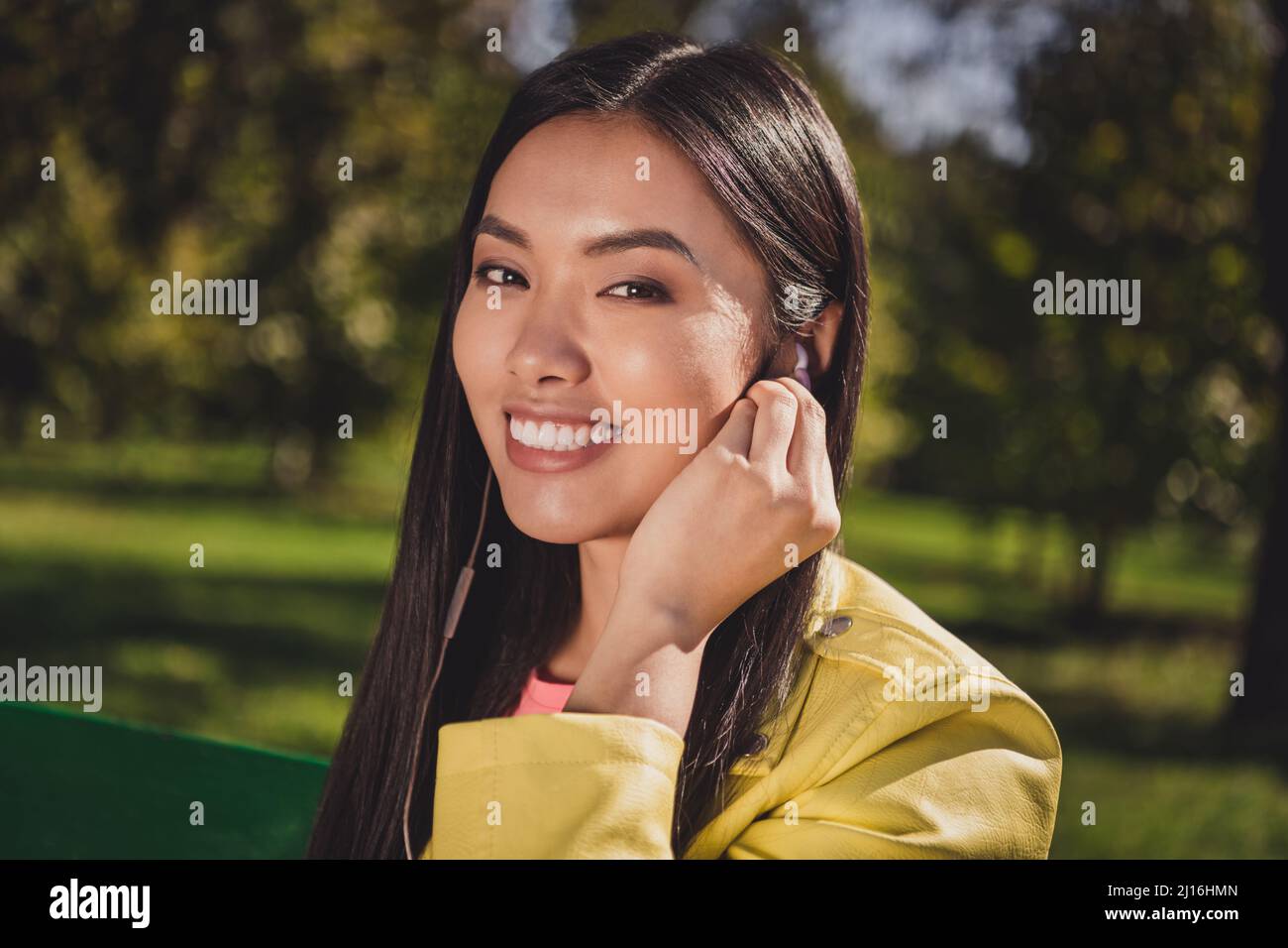 Portrait of attractive cheerful long-haired girl listening single ...