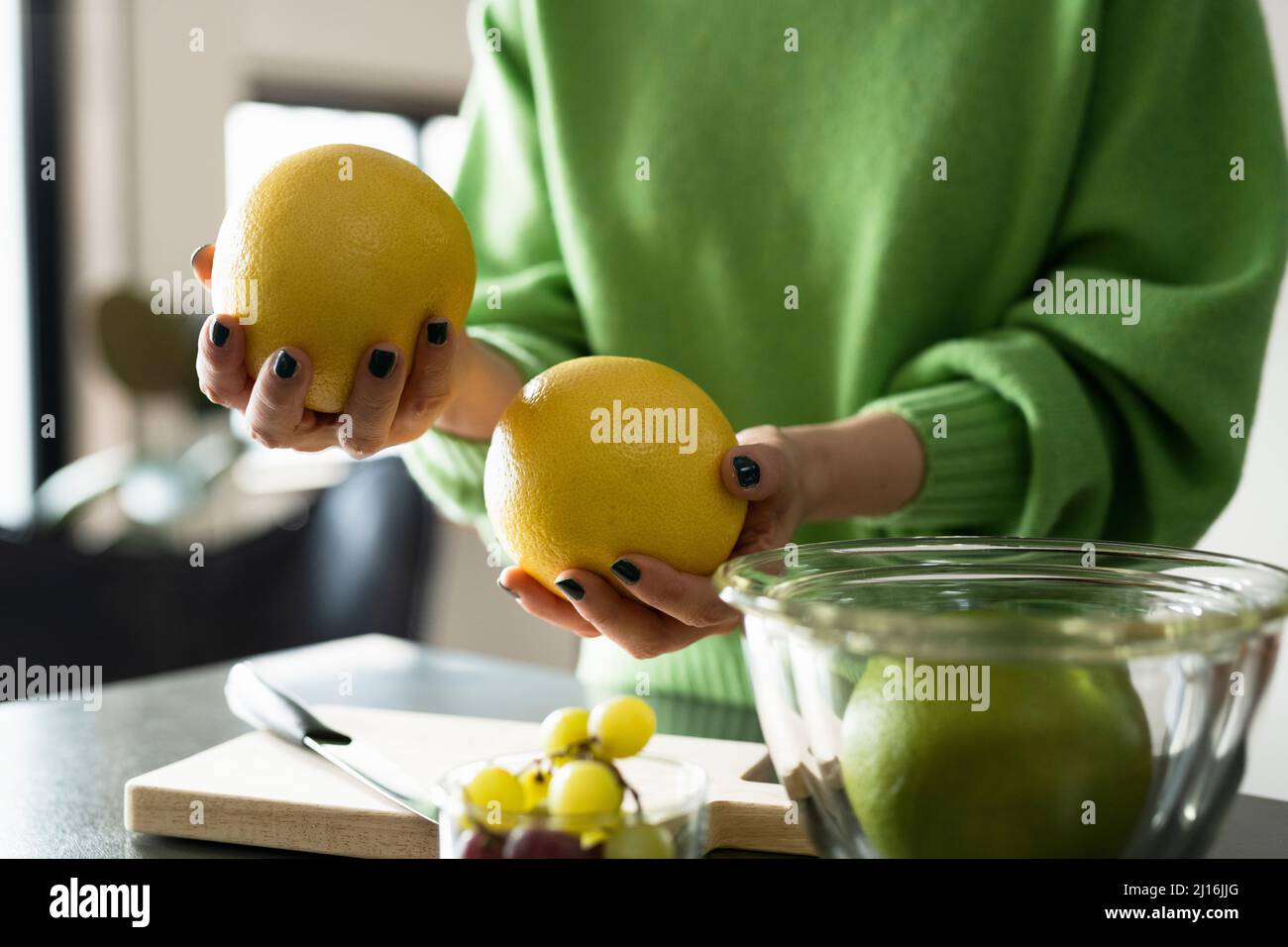 Woman Having Grapefruit Stock Photo - Alamy
