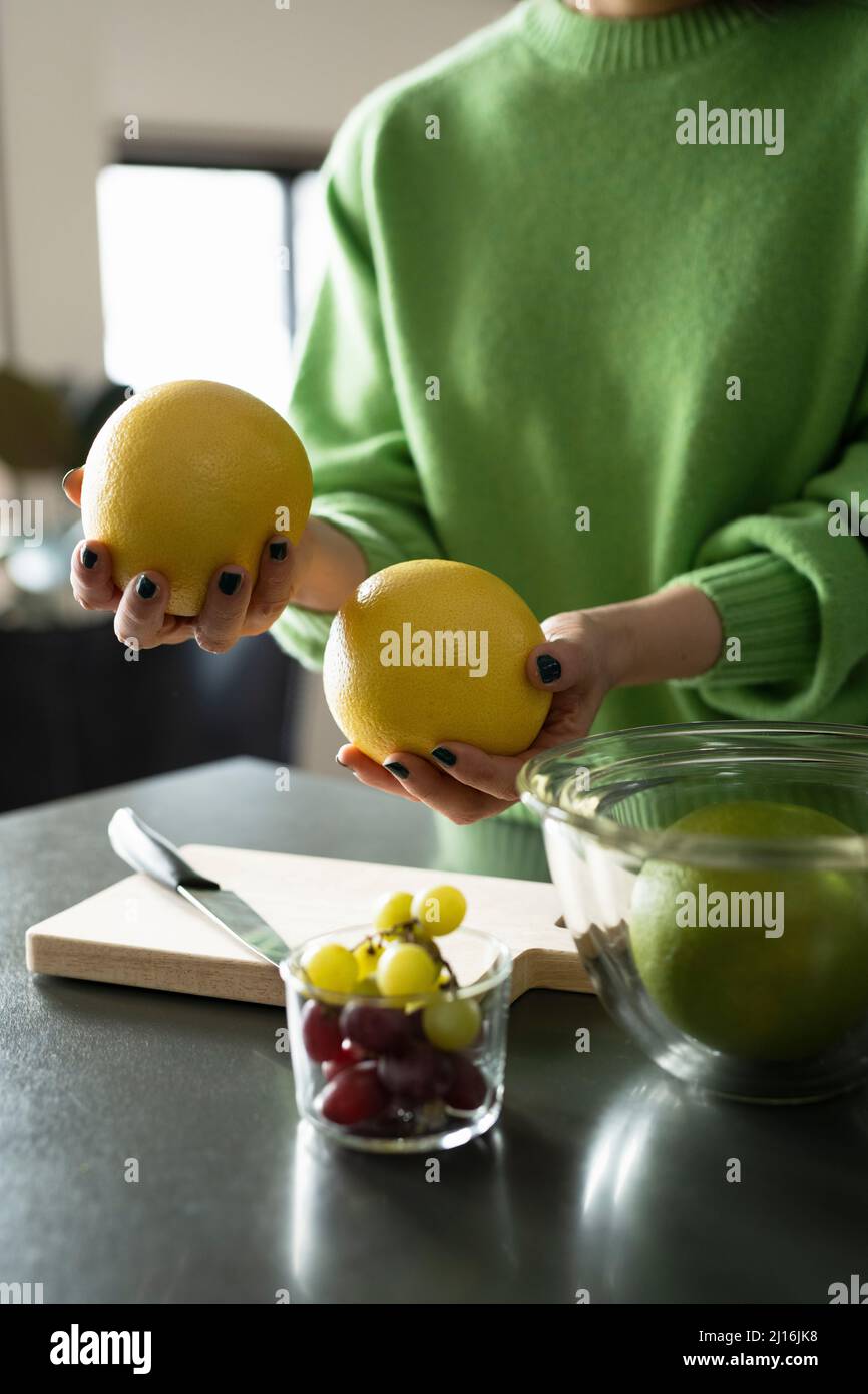 Woman Having Grapefruit Stock Photo - Alamy