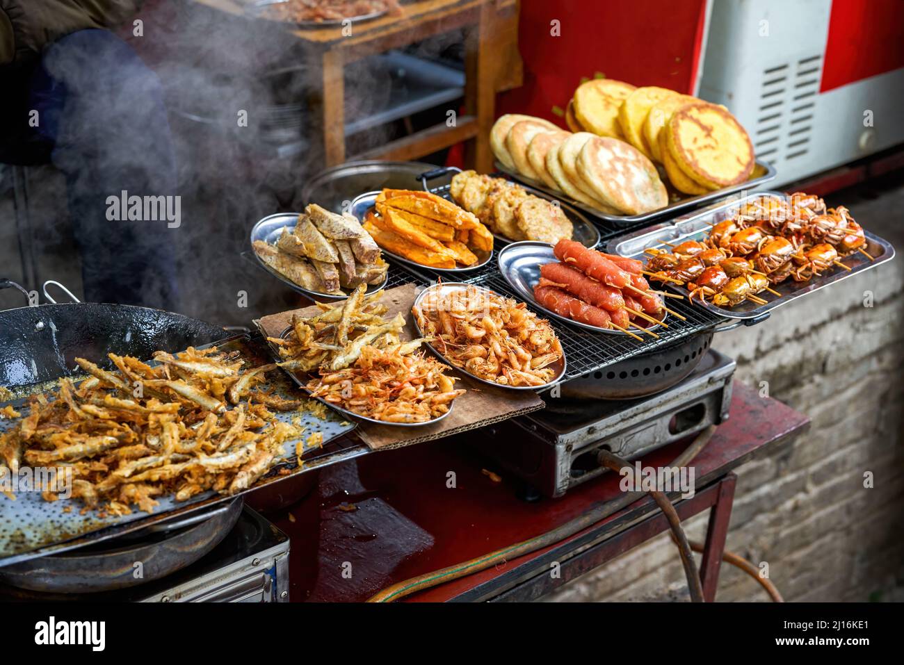 Beachside street food, fried small crabs and fried sea fish Stock Photo ...