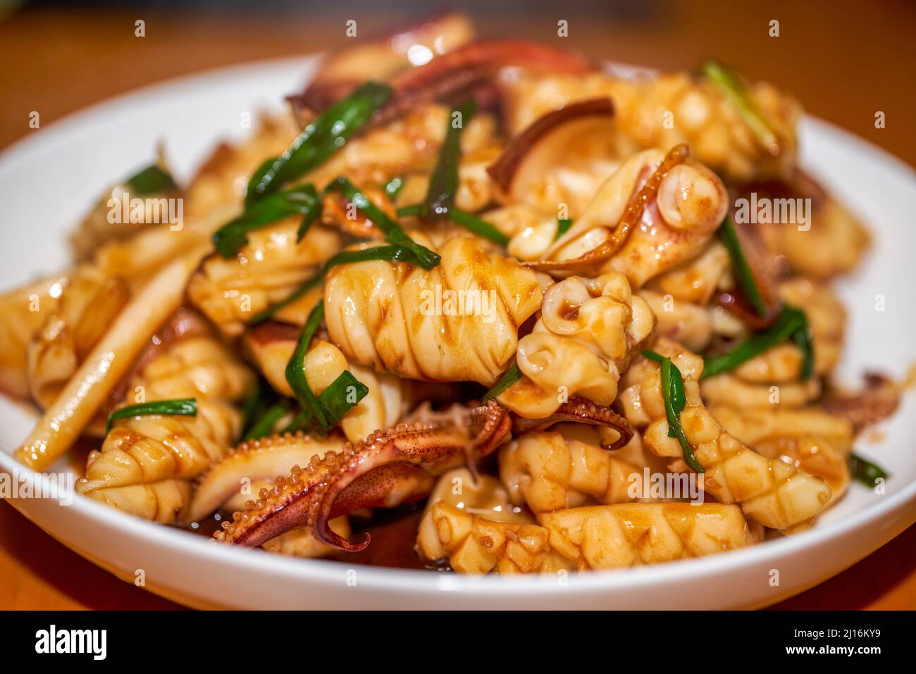 A delicious Chinese home-style dish, fried squid in sauce Stock Photo ...