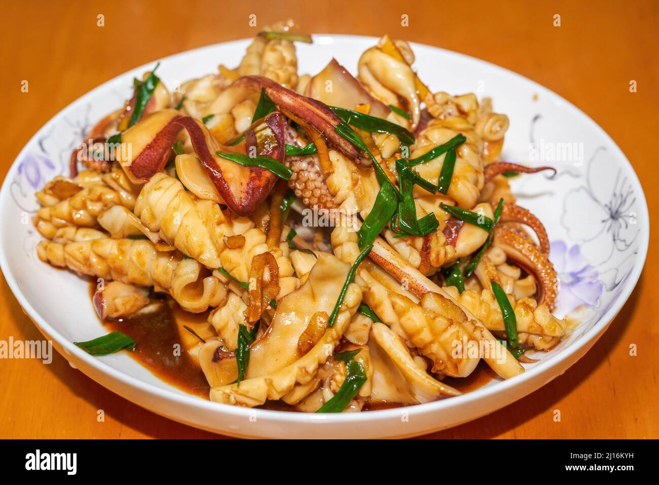 A delicious Chinese home-style dish, fried squid in sauce Stock Photo ...