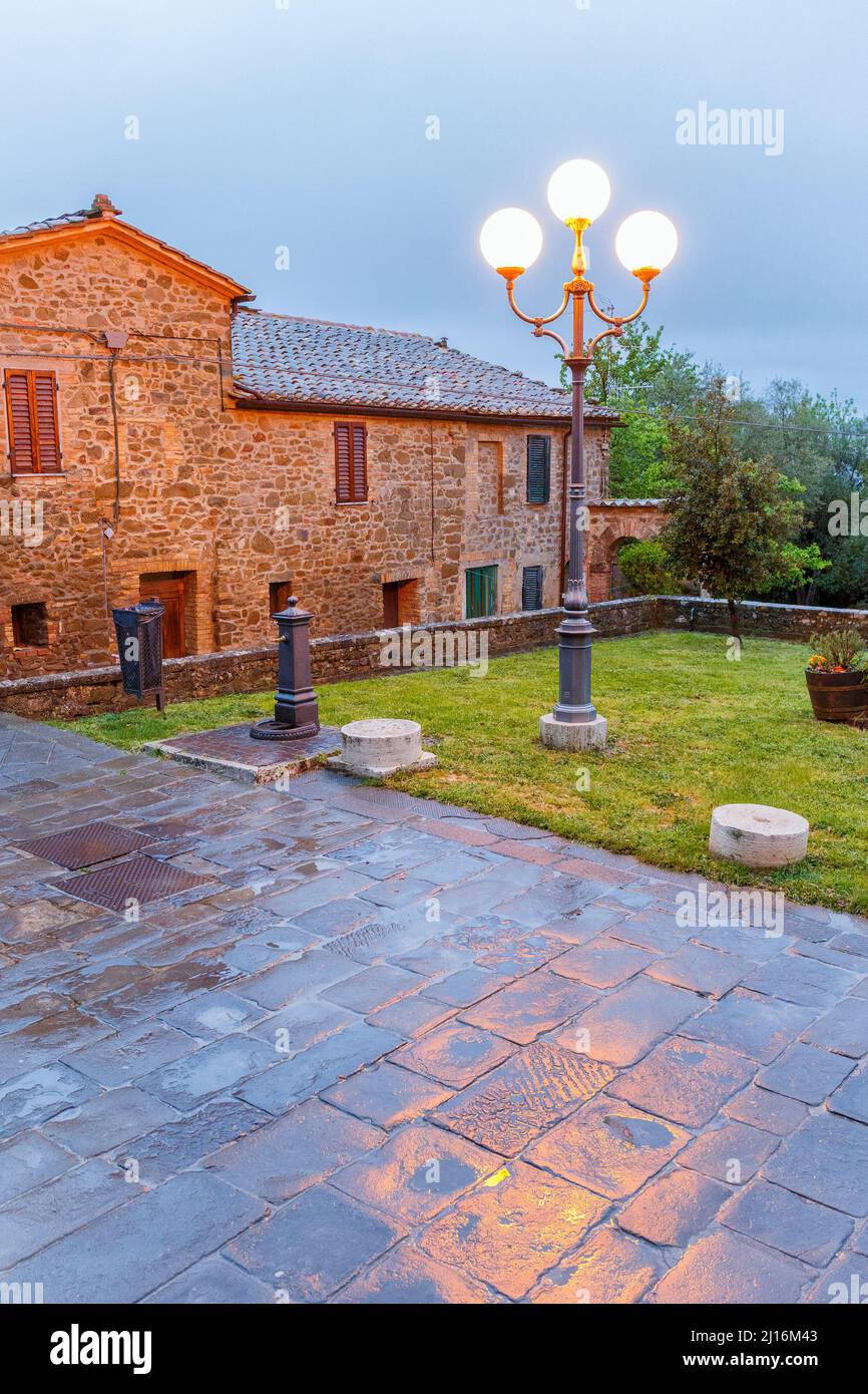 Street lamp with reflections on the paving stones Stock Photo - Alamy