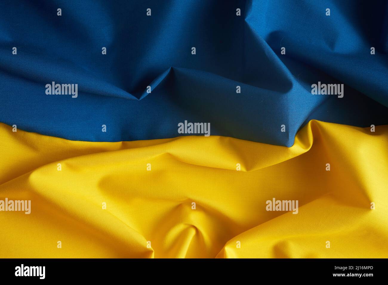 Fabric curved flag of Ukraine. Blue and yellow colors. UA flag ...