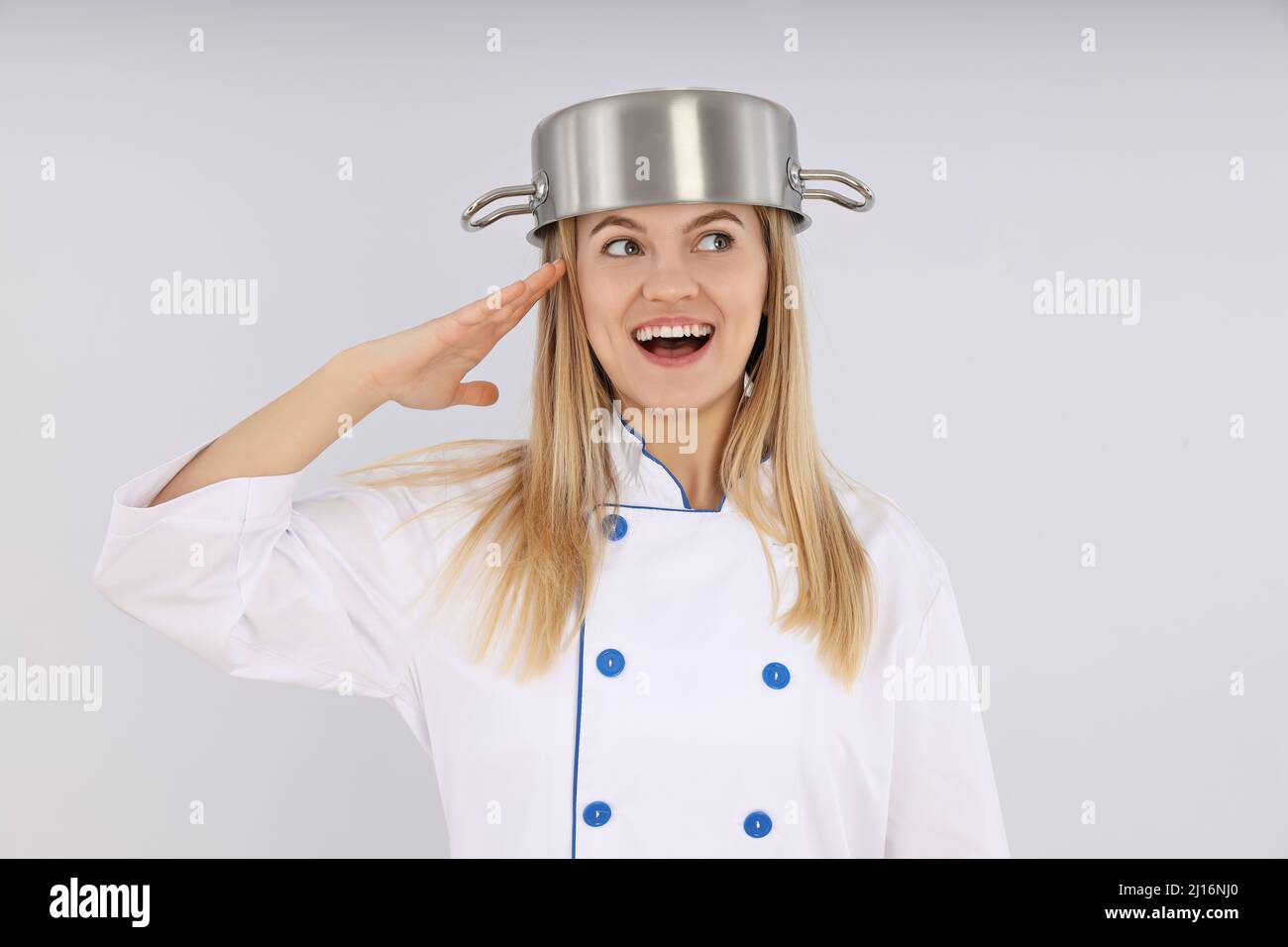 Funny young chef woman on light background Stock Photo - Alamy