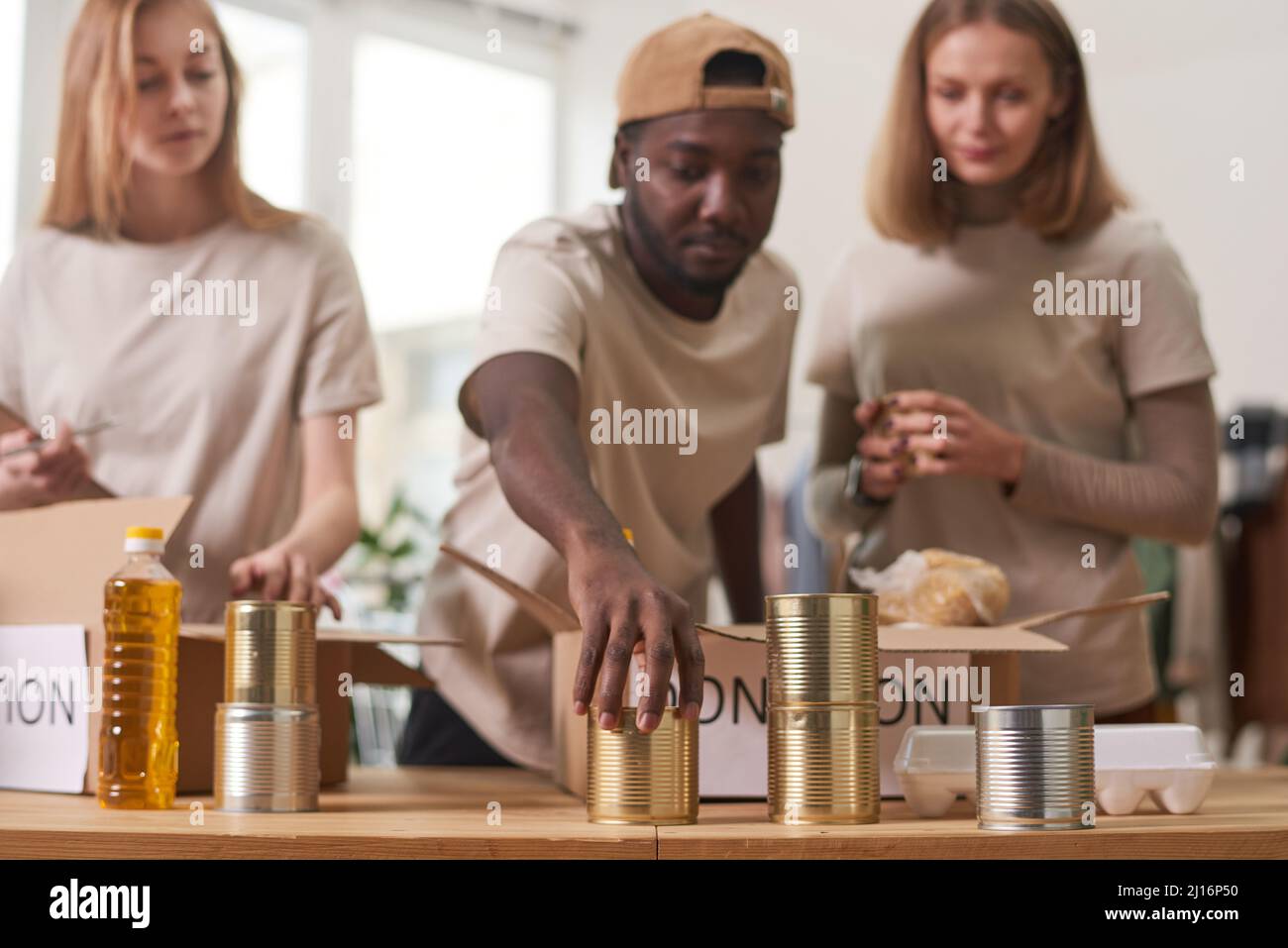 African american people packing products hi-res stock photography and ...