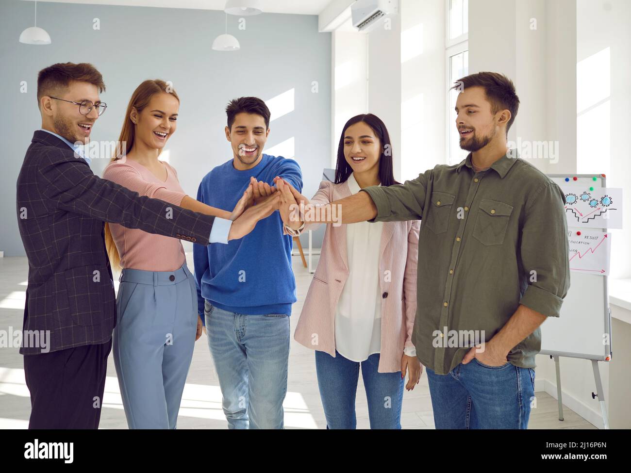 Happy office business team together give five to each other ...