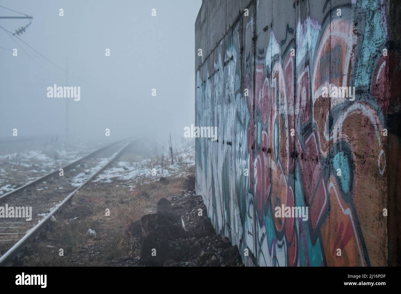 Lonely train tracks during a foggy winter day Stock Photo - Alamy