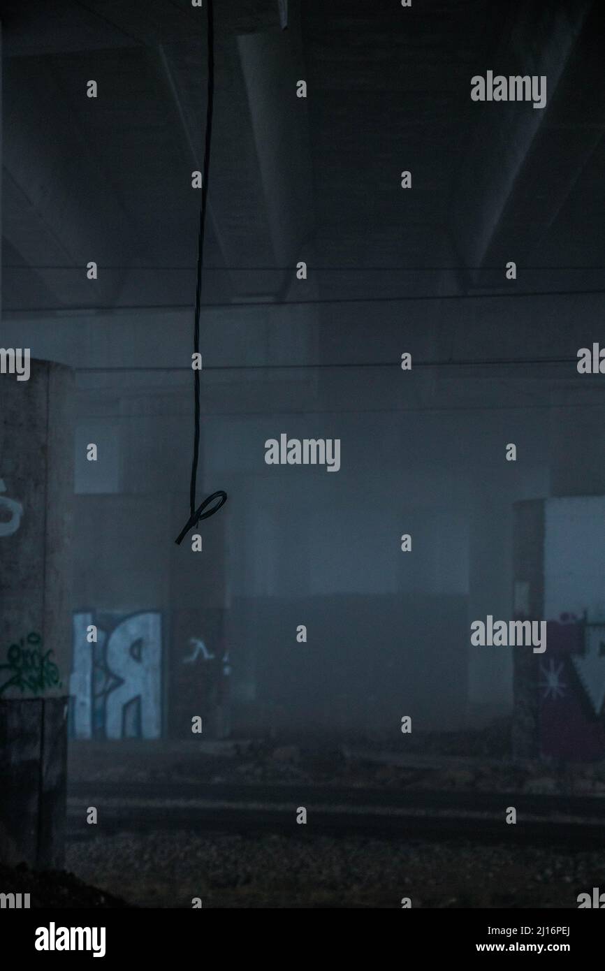 Cable under a bridge Stock Photo - Alamy