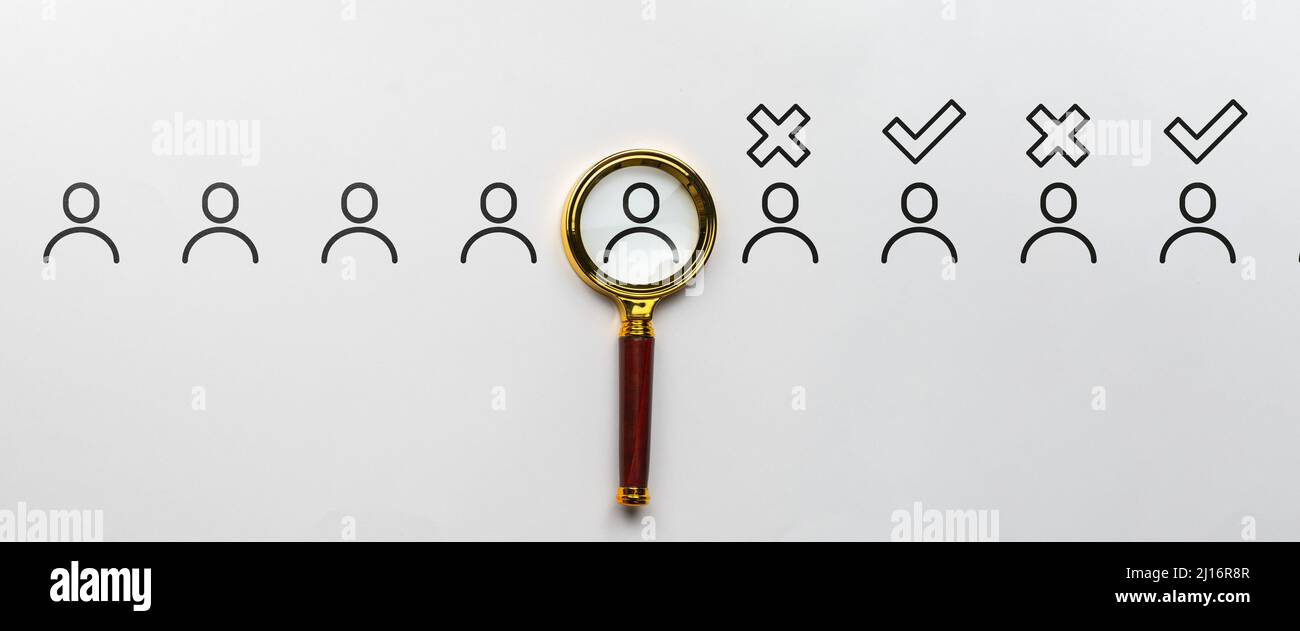 Selection of job candidates. Magnifying glass with abstract personas ...