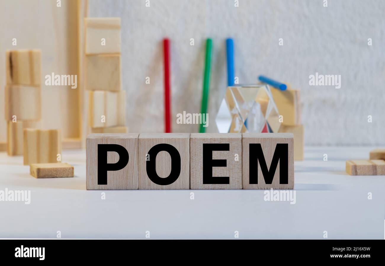 Word poem made with block wooden letters next to a pile of other ...