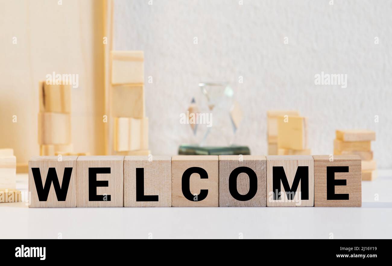 The word WELCOME made of letters on wooden blocks Stock Photo - Alamy